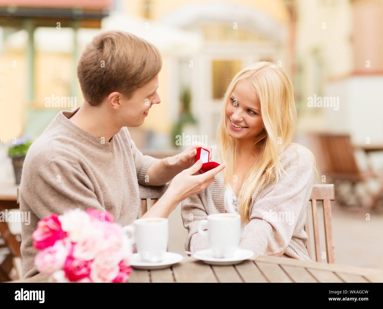 romantic man proposing to beautiful woman Stock Photo - Alamy