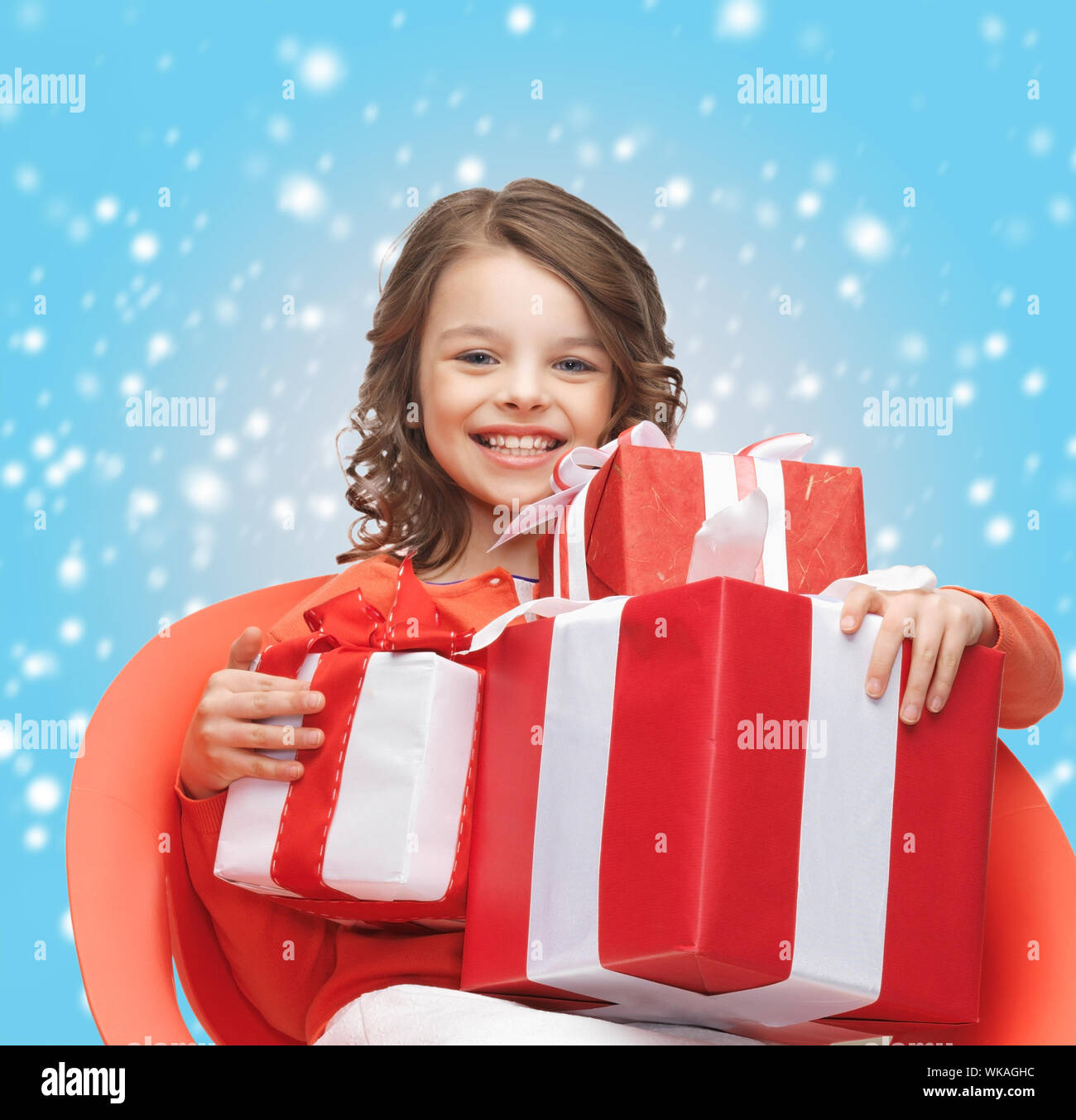happy child girl with gift boxes Stock Photo - Alamy