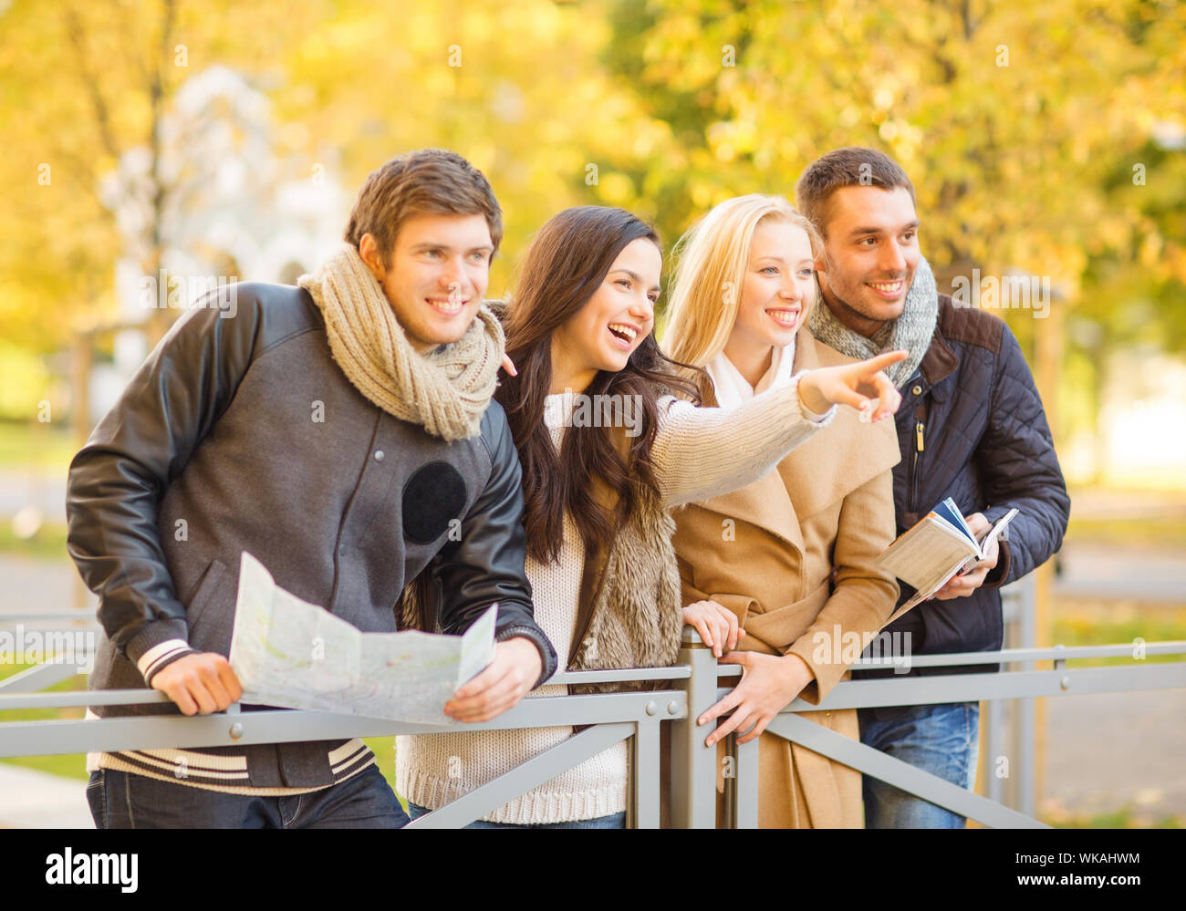 holidays and tourism concept - group of friends or couples with tourist ...