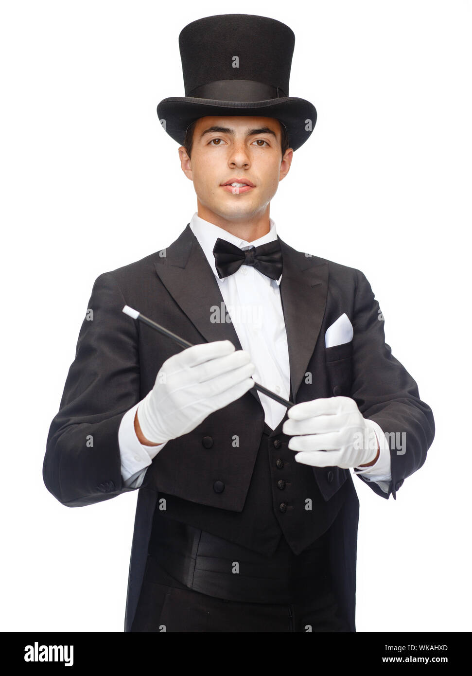 performance, circus, show concept - magician in top hat with magic wand ...