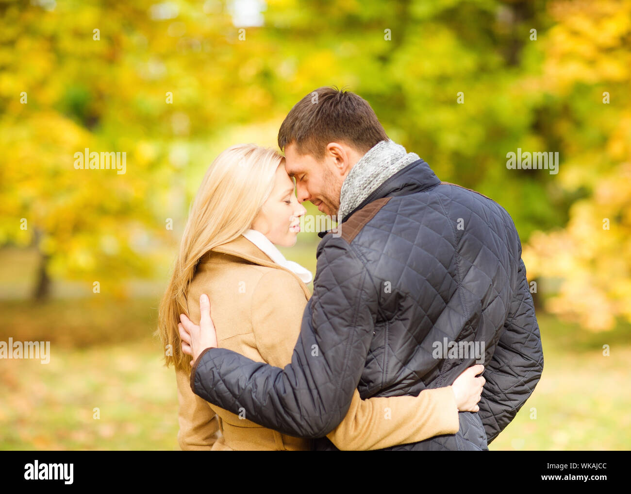 romantic couple kissing in the autumn park Stock Photo - Alamy