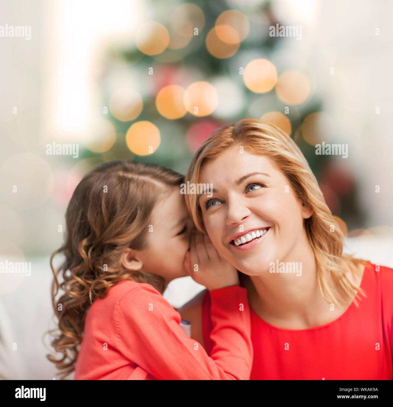 mother and daughter whispering gossip Stock Photo - Alamy