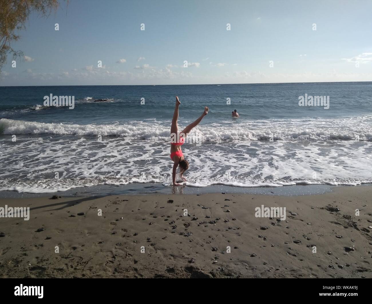 Woman handstand beach sand hi-res stock photography and images - Alamy