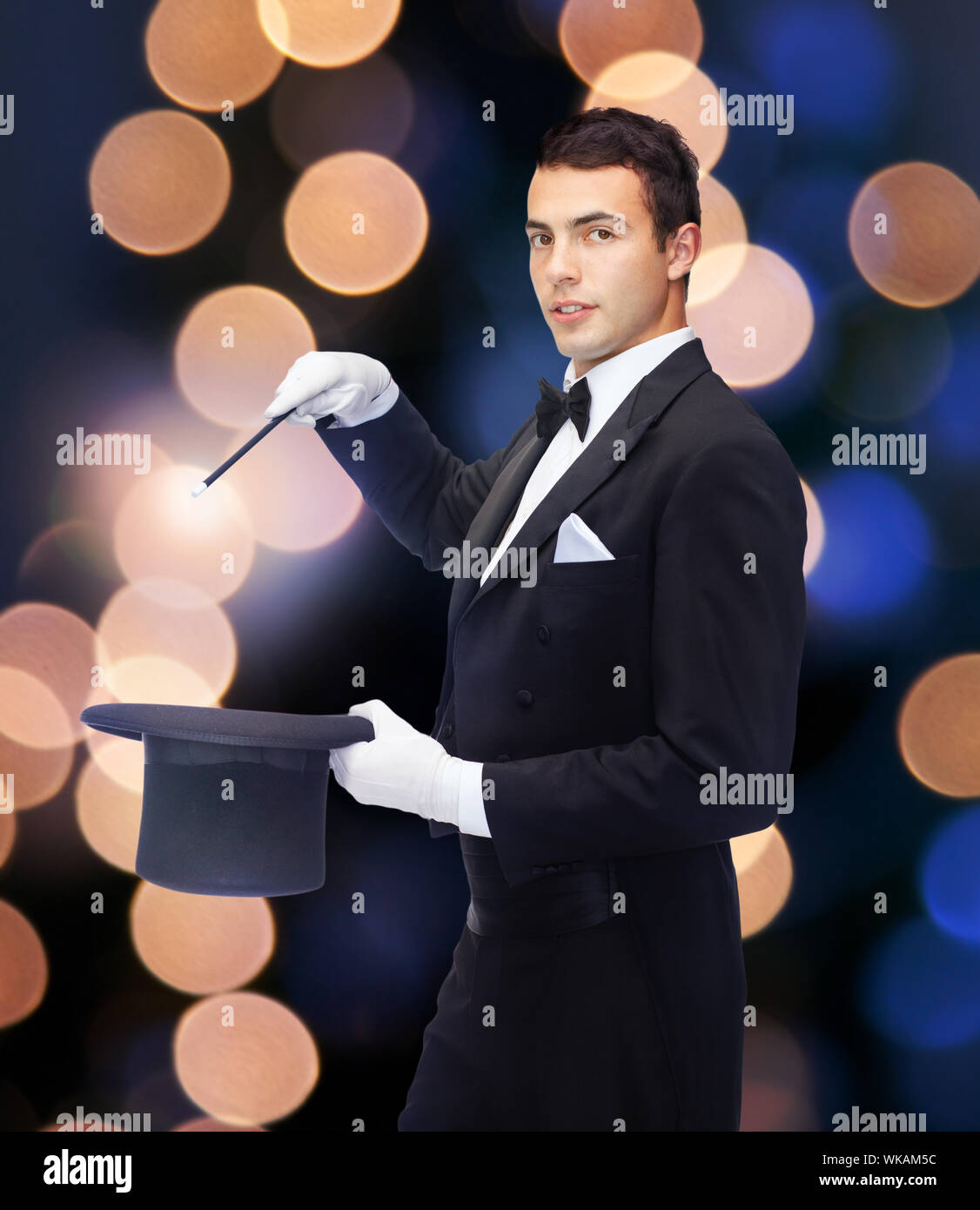 magician in top hat with magic wand showing trick Stock Photo - Alamy