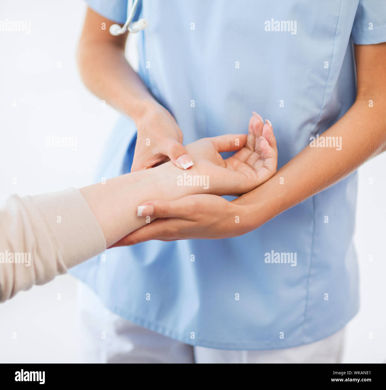 nurse with patient measuring pulse Stock Photo - Alamy
