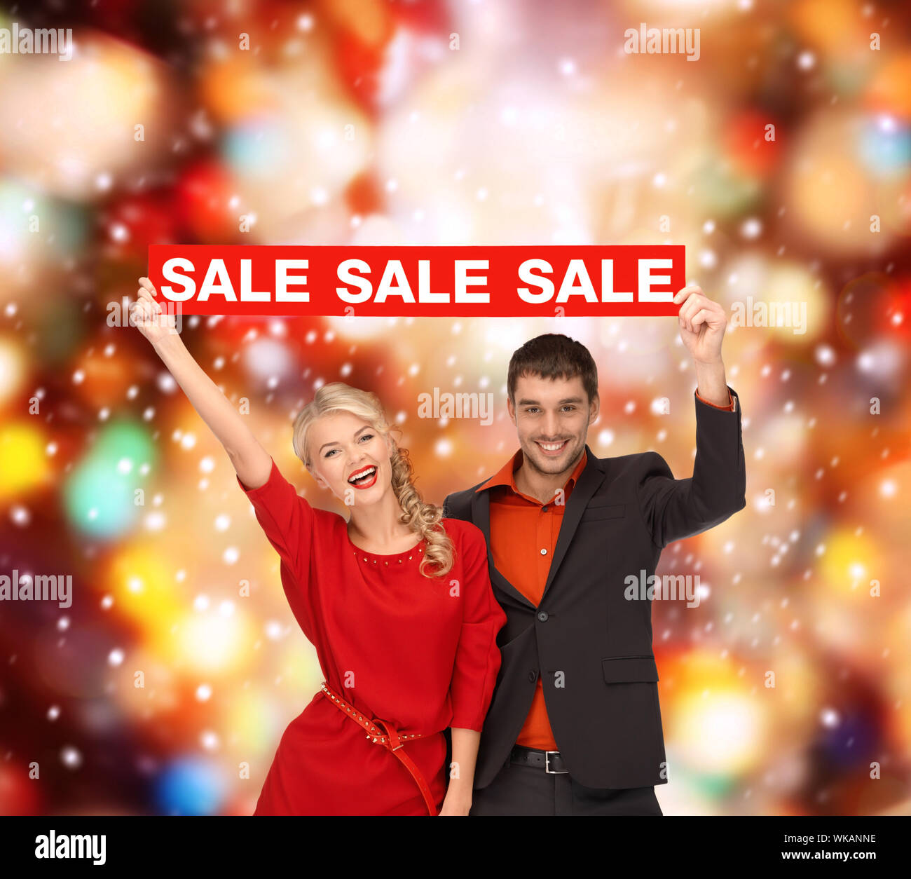 woman and man with red sale sign Stock Photo - Alamy