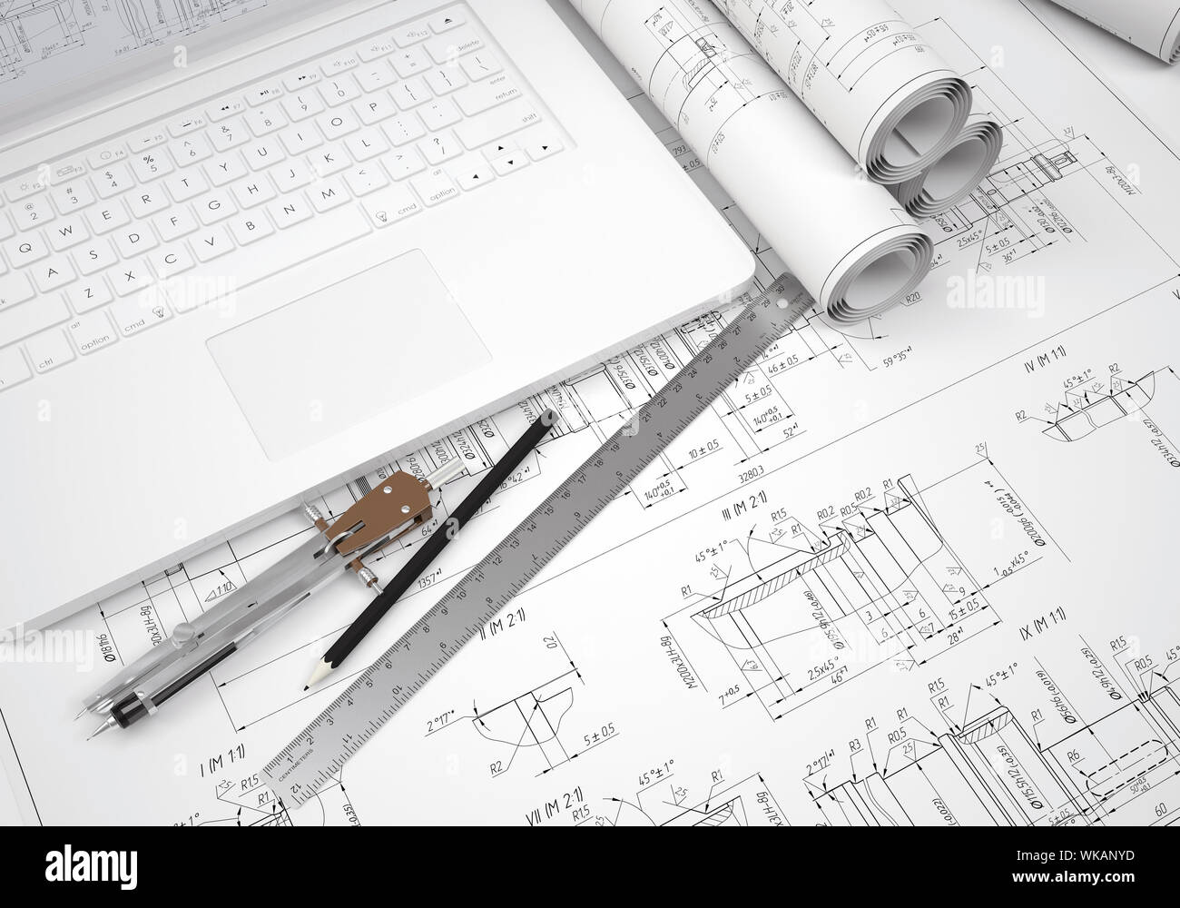 Scrolls engineering drawings and laptop. Desk Engineer Stock Photo - Alamy