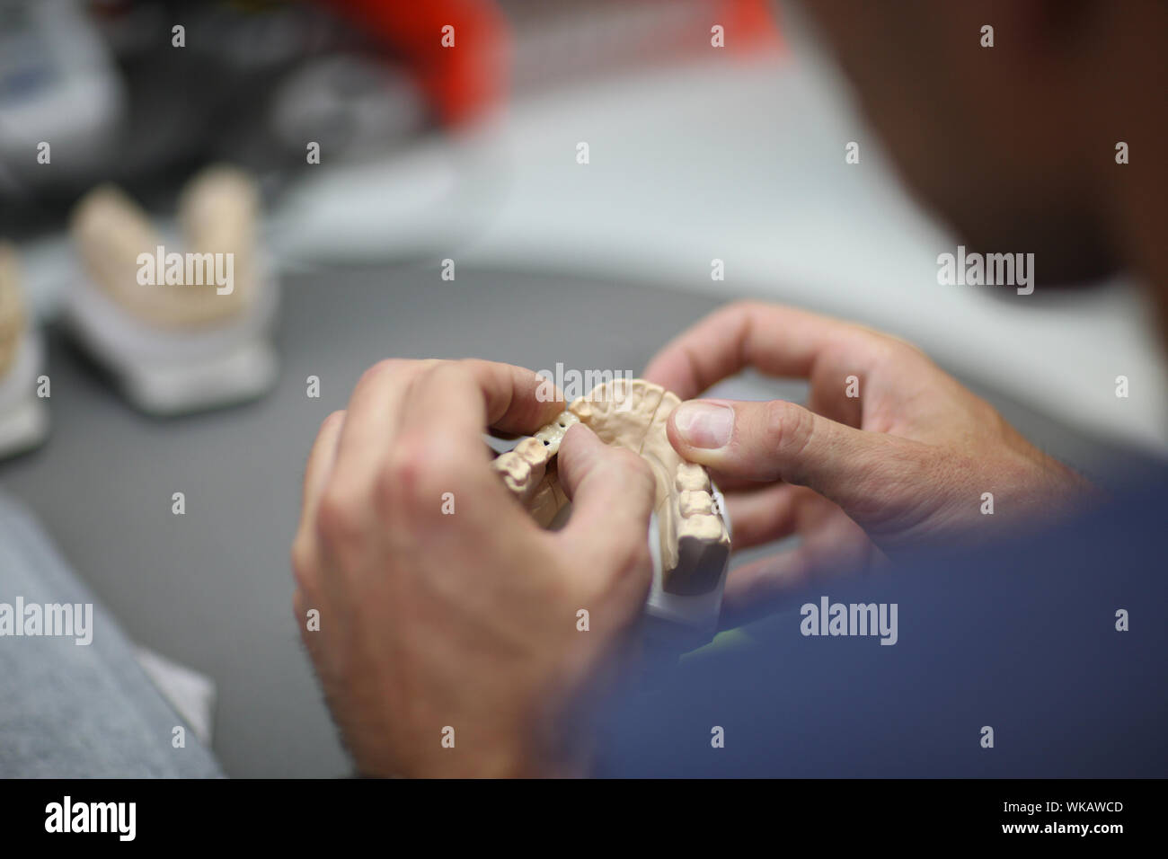 The process of manufacturing dentures in the dental laboratory Stock ...