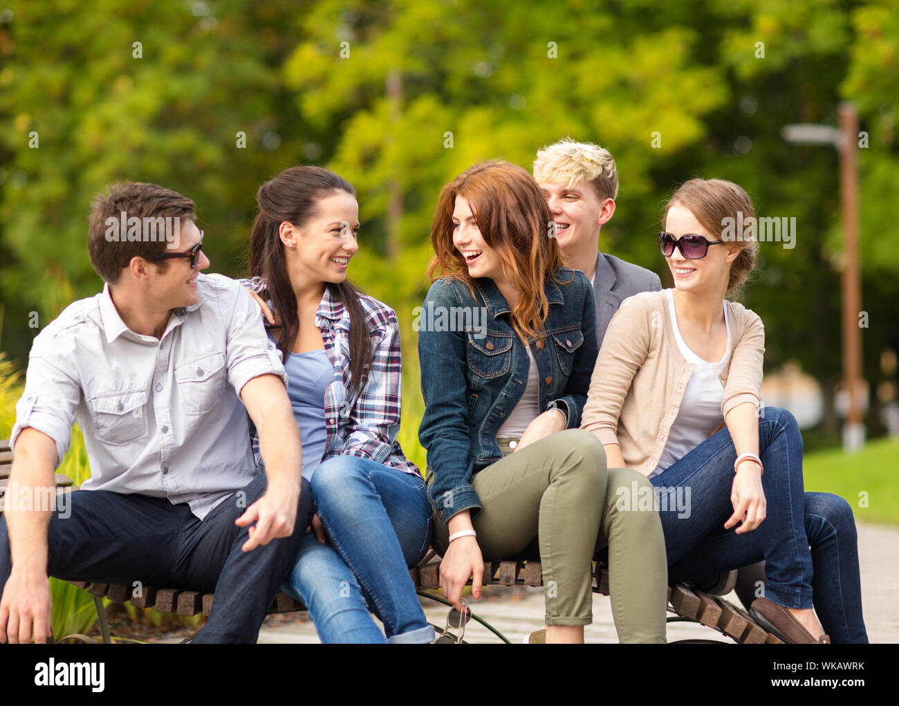 summer holidays, education, campus and teenage concept - group of ...