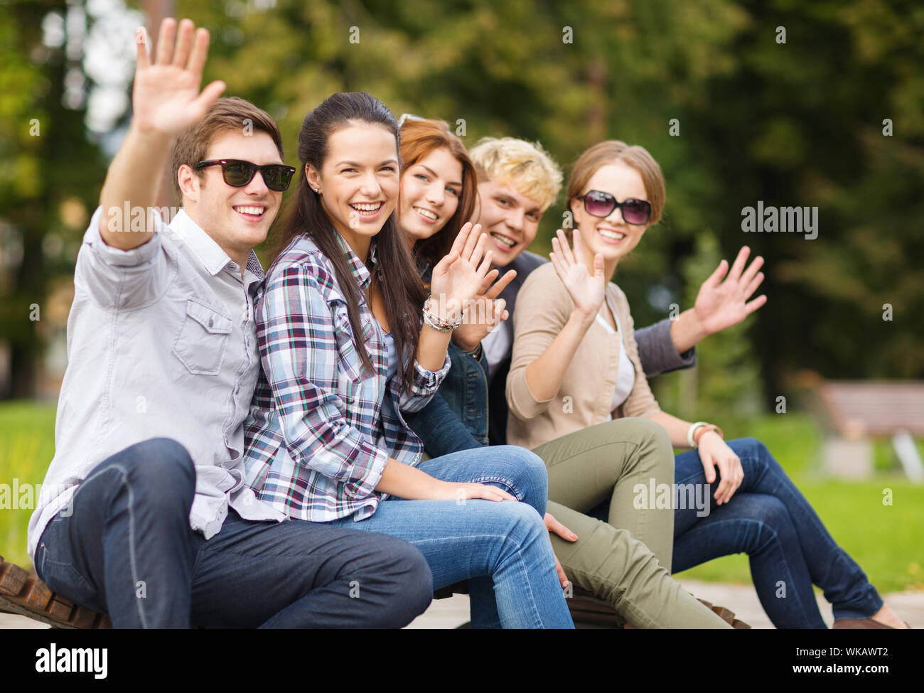 group of students or teenagers waving hands Stock Photo - Alamy