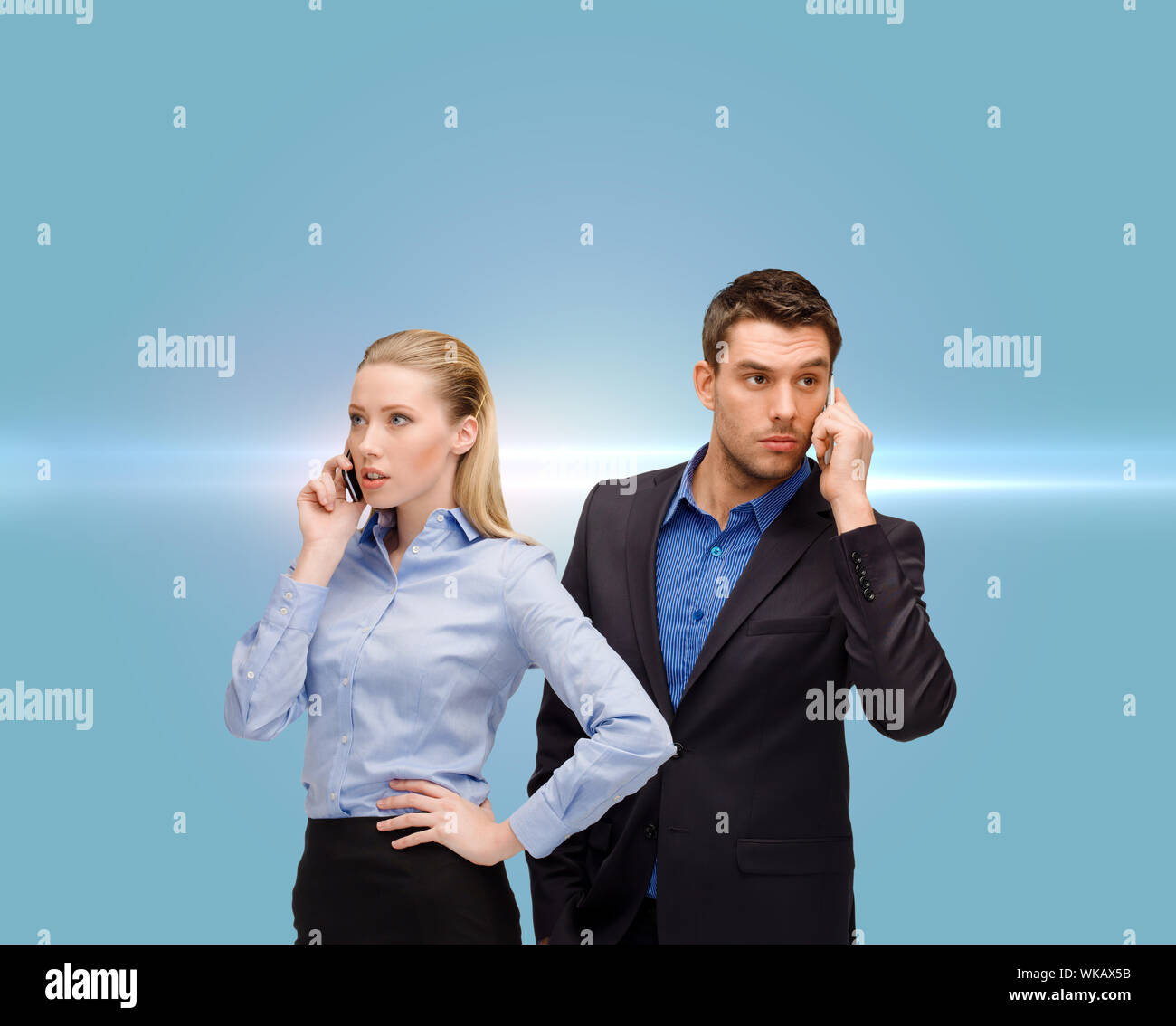 woman and man with cell phones calling Stock Photo - Alamy