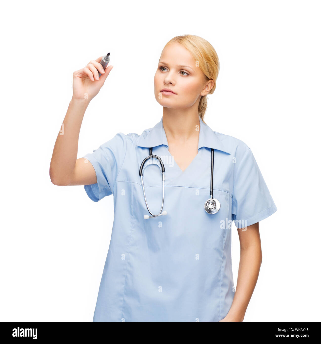 healthcare, medical and technology - young doctor or nurse writing ...
