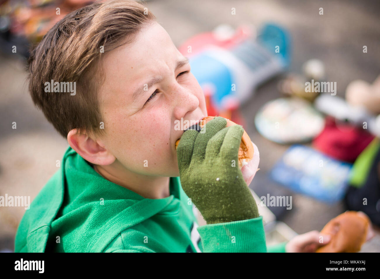 Boy biting food hi-res stock photography and images - Alamy