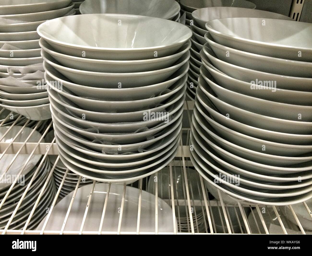 Stack Of Plates On Rack Stock Photo - Alamy