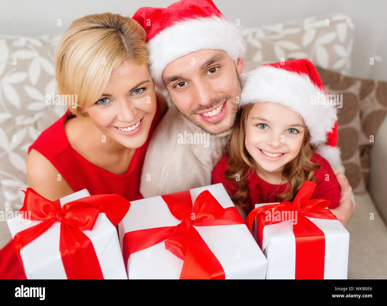 smiling family holding many gift boxes Stock Photo - Alamy