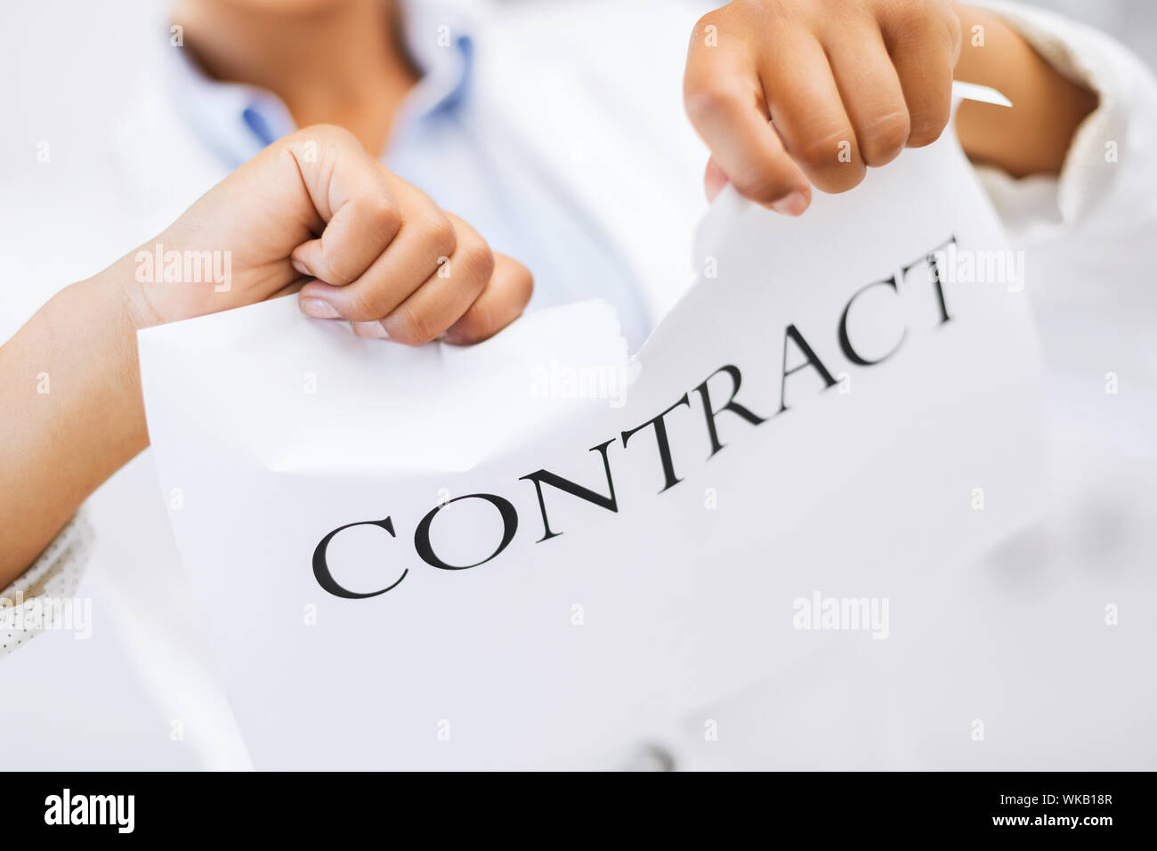woman hands tearing contract paper Stock Photo - Alamy