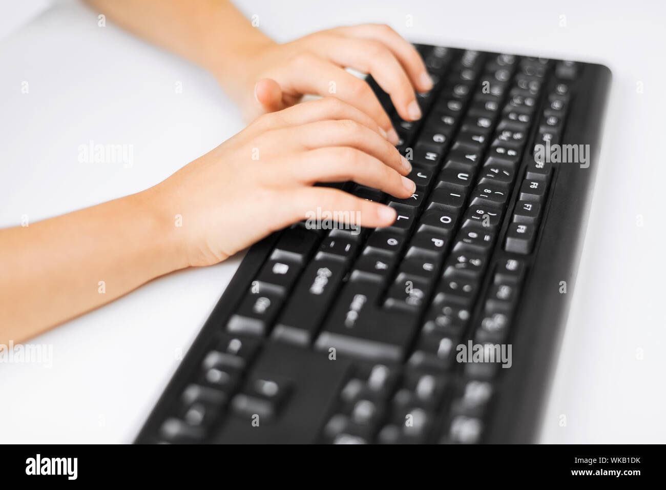 student girls hands typing on keyboard Stock Photo - Alamy