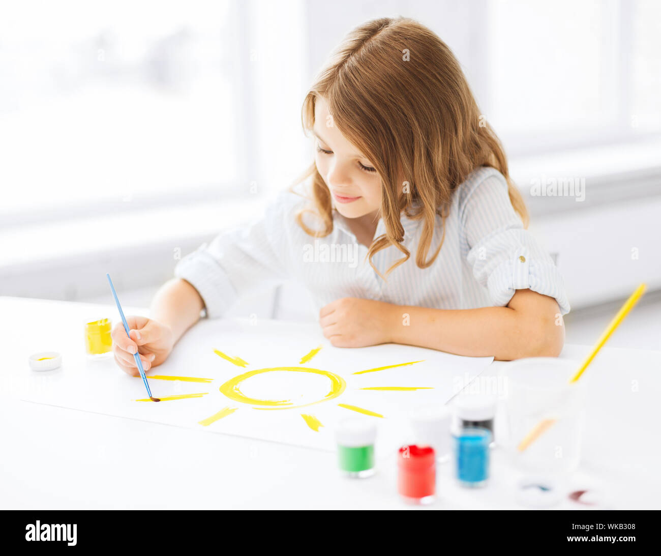 education, school, art and painitng concept - little student girl ...
