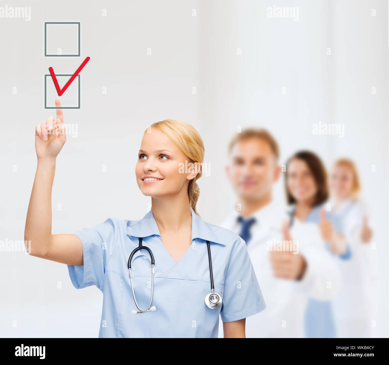 healthcare, medical and technology - young doctor or nurse with marker ...