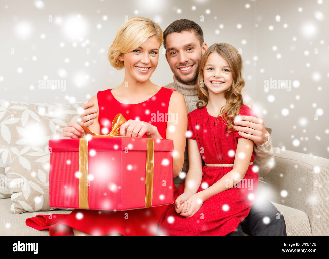 happy family opening gift box Stock Photo - Alamy