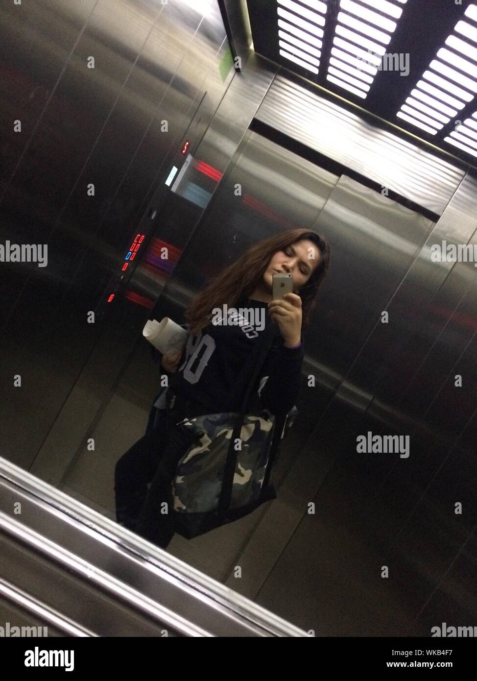 People in mirror elevator hi-res stock photography and images - Alamy