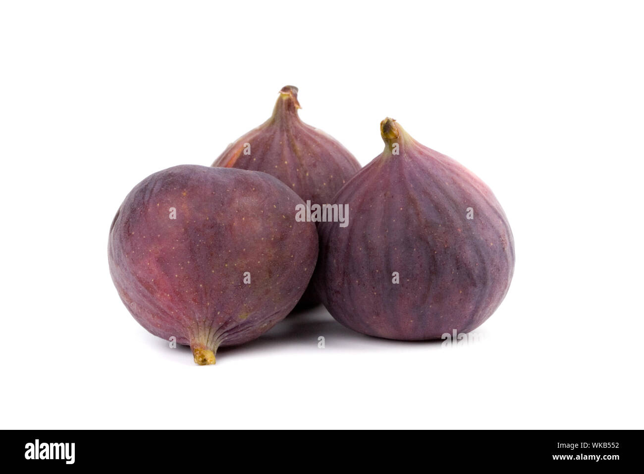 three fresh figs isolated on white background Stock Photo - Alamy