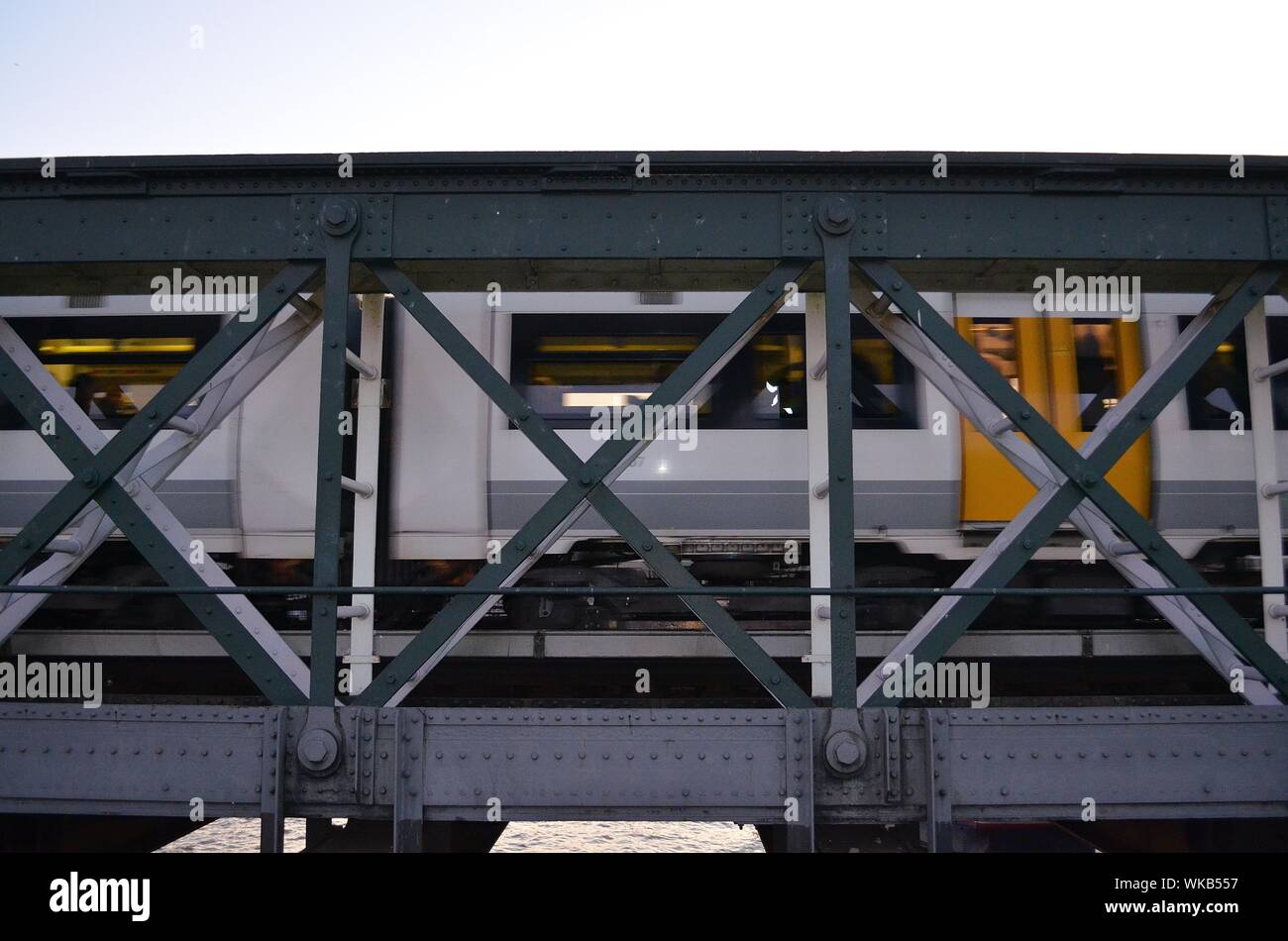 Train On Bridge Against Clear Sky Stock Photo - Alamy