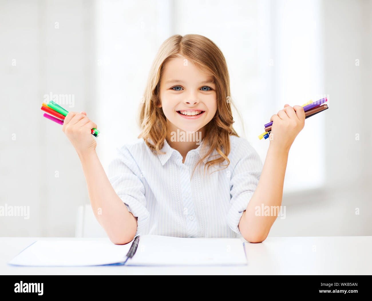 education, creation and school concept - smiling little student girl ...
