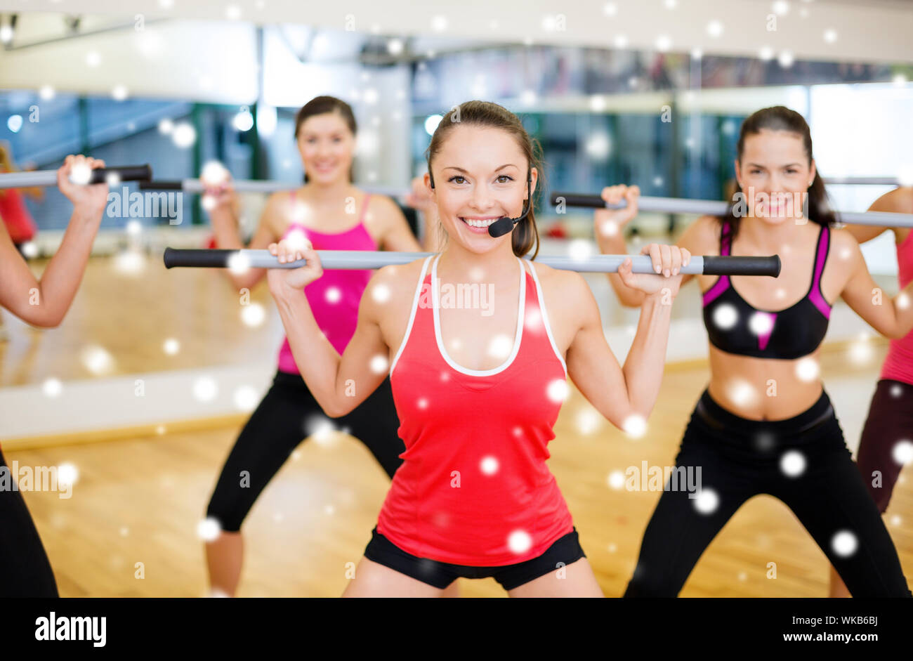 group of smiling people working out with barbells Stock Photo - Alamy