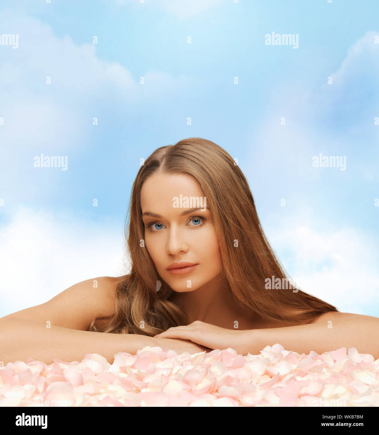 beautiful woman with long hair and rose petals Stock Photo - Alamy