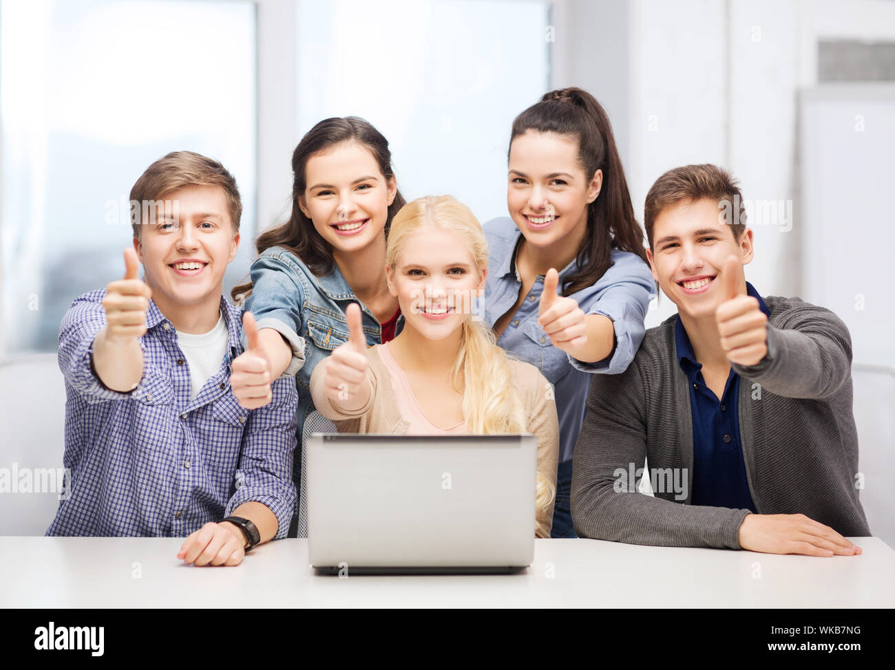 education, technology and internet concept - smiling students with ...