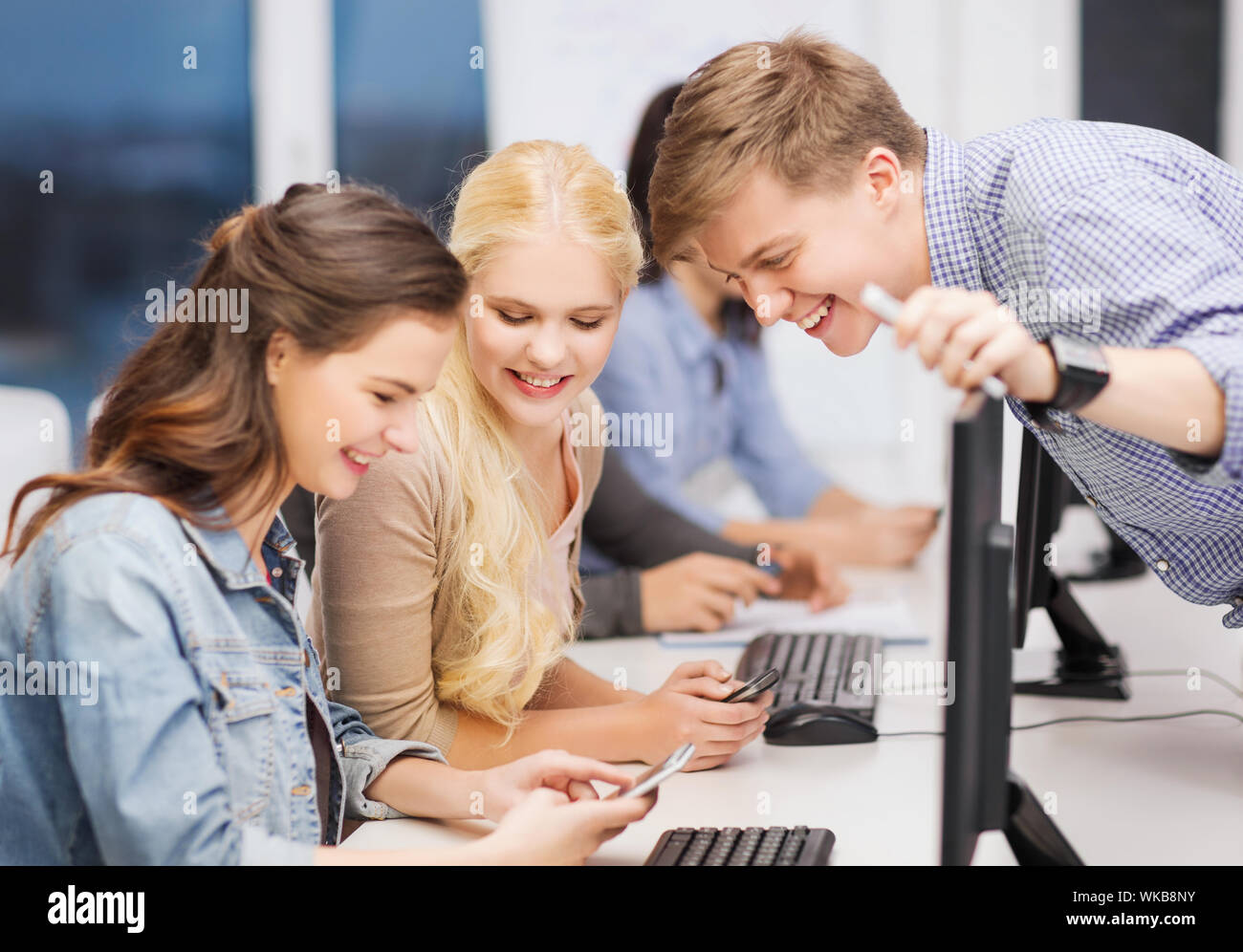 students with computer monitor and smartphones Stock Photo - Alamy