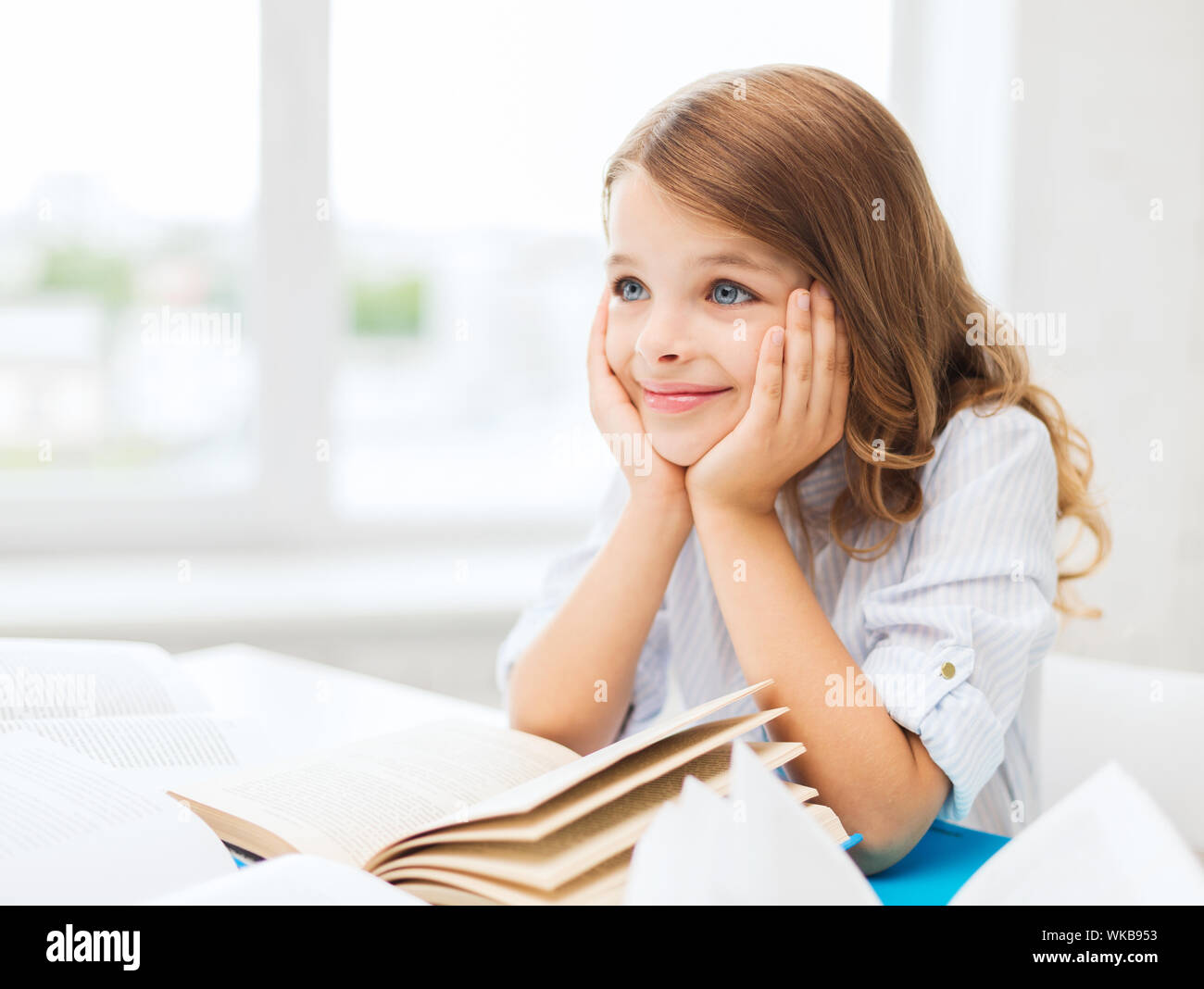 student girl writing in notebook at school Stock Photo - Alamy