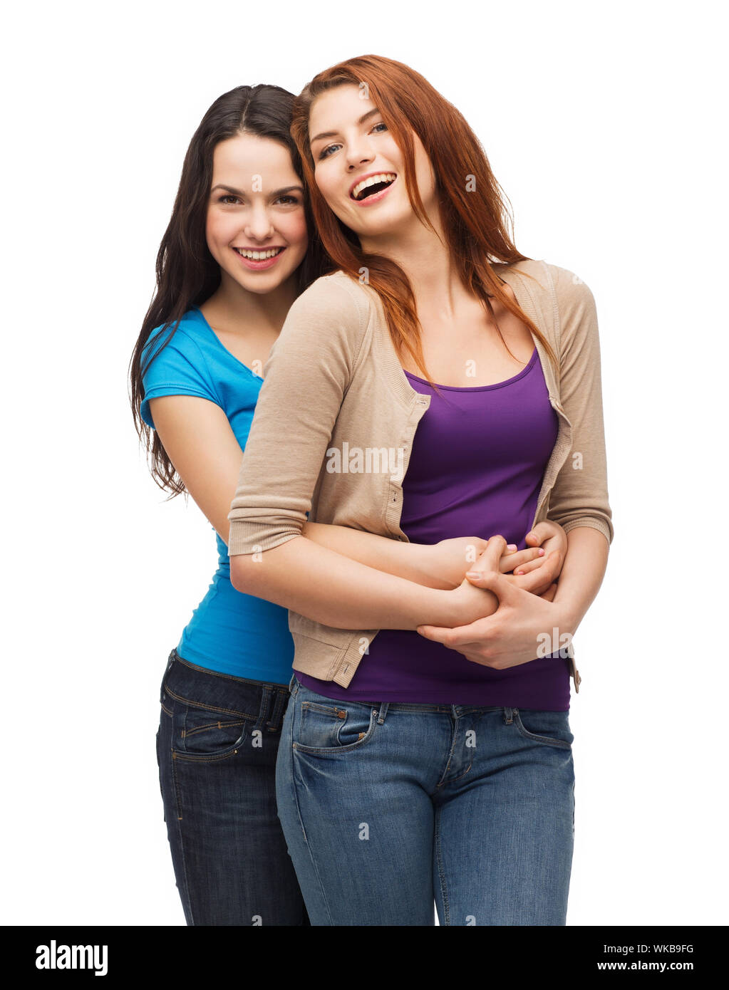 friendship and happy people concept - two laughing girls hugging Stock ...