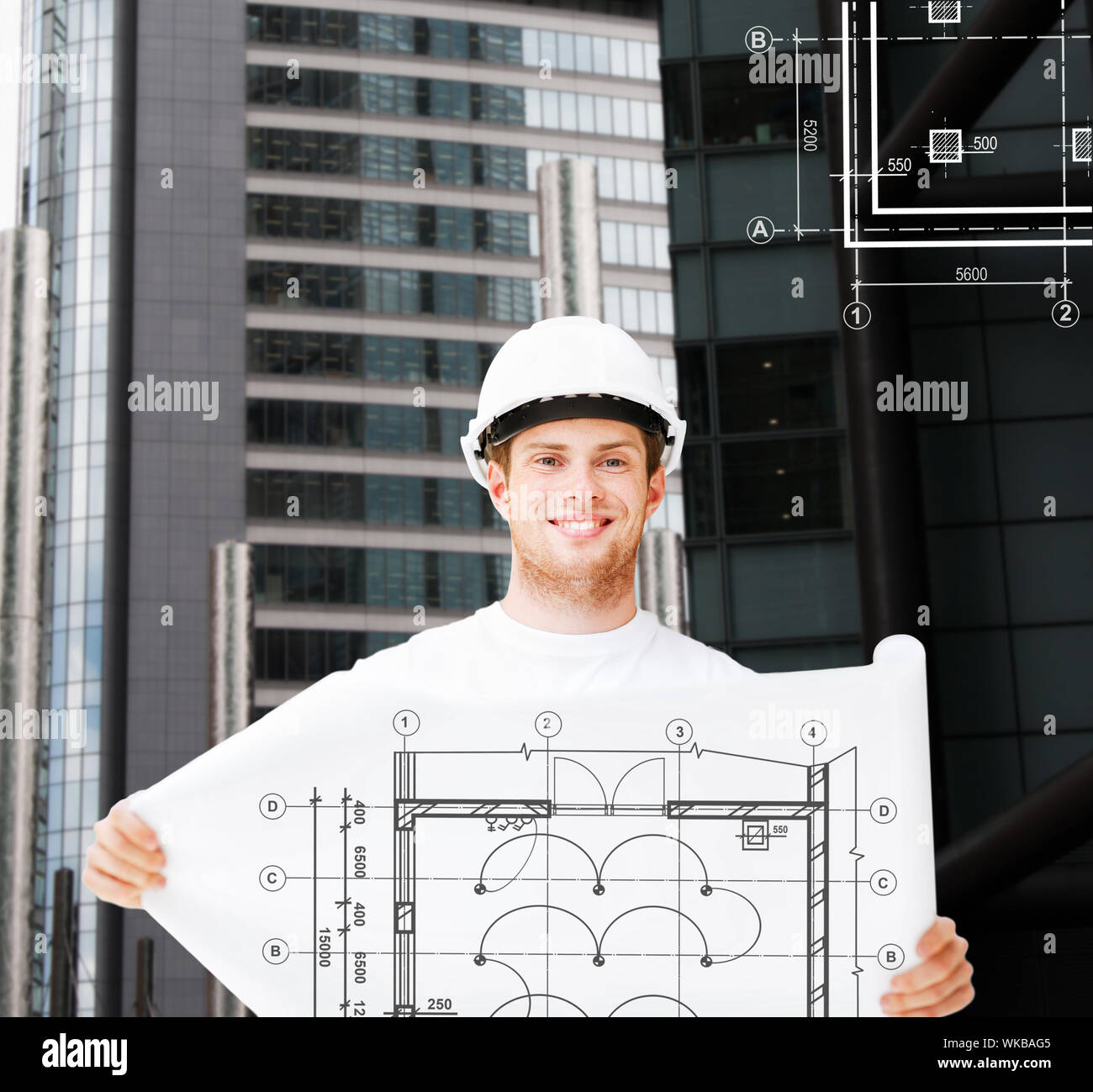 male architect in white helmet with blueprint Stock Photo - Alamy