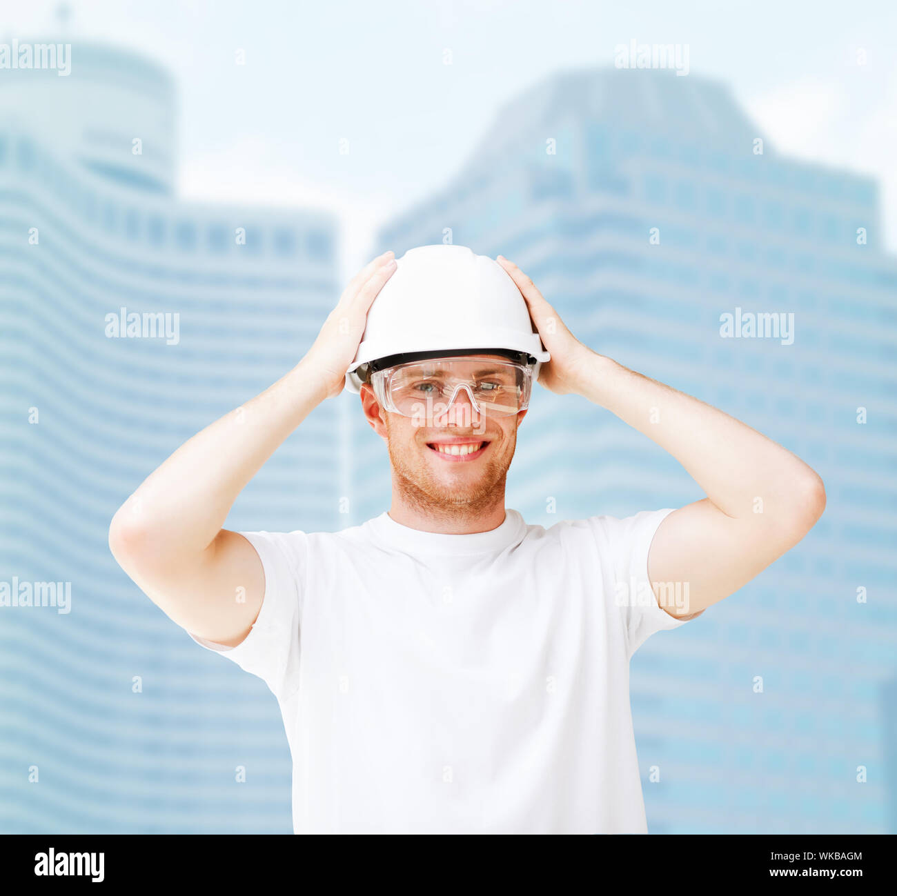 male architect in helmet with safety glasses Stock Photo - Alamy