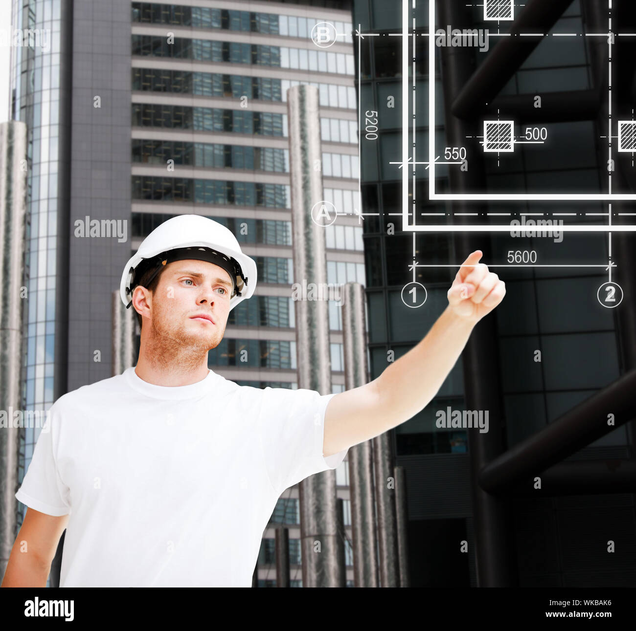 male architect pointing at blueprint Stock Photo - Alamy