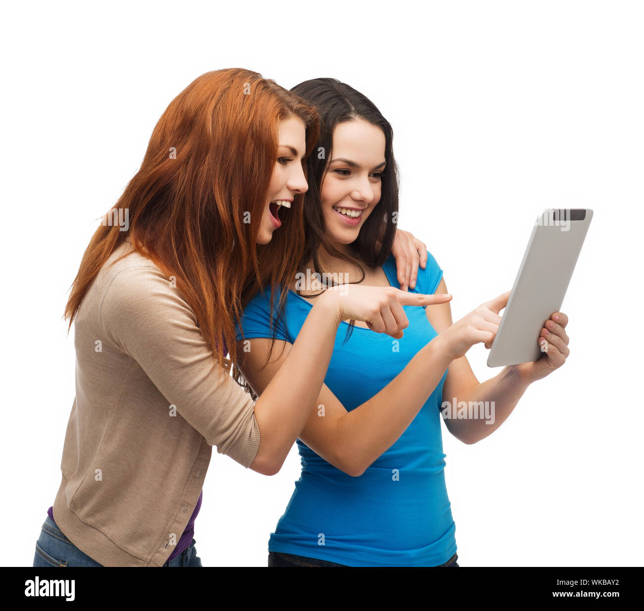technology, friendship and people concept - two smiling teenagers ...