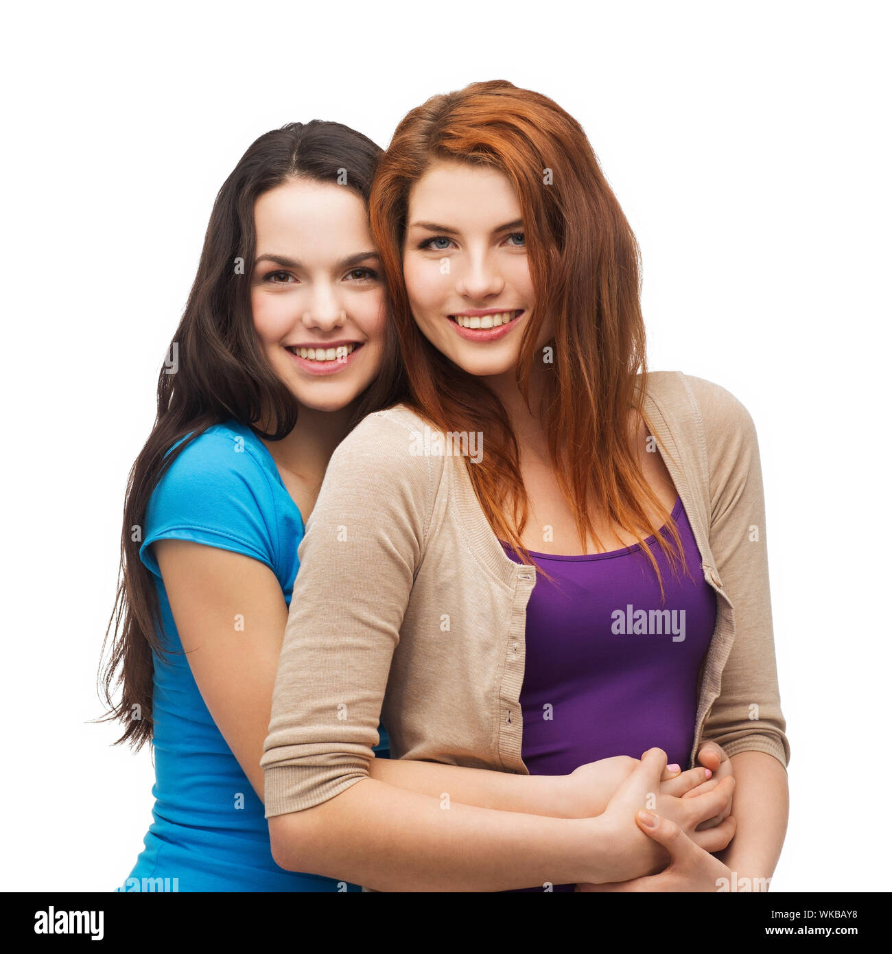 two smiling girls hugging Stock Photo - Alamy