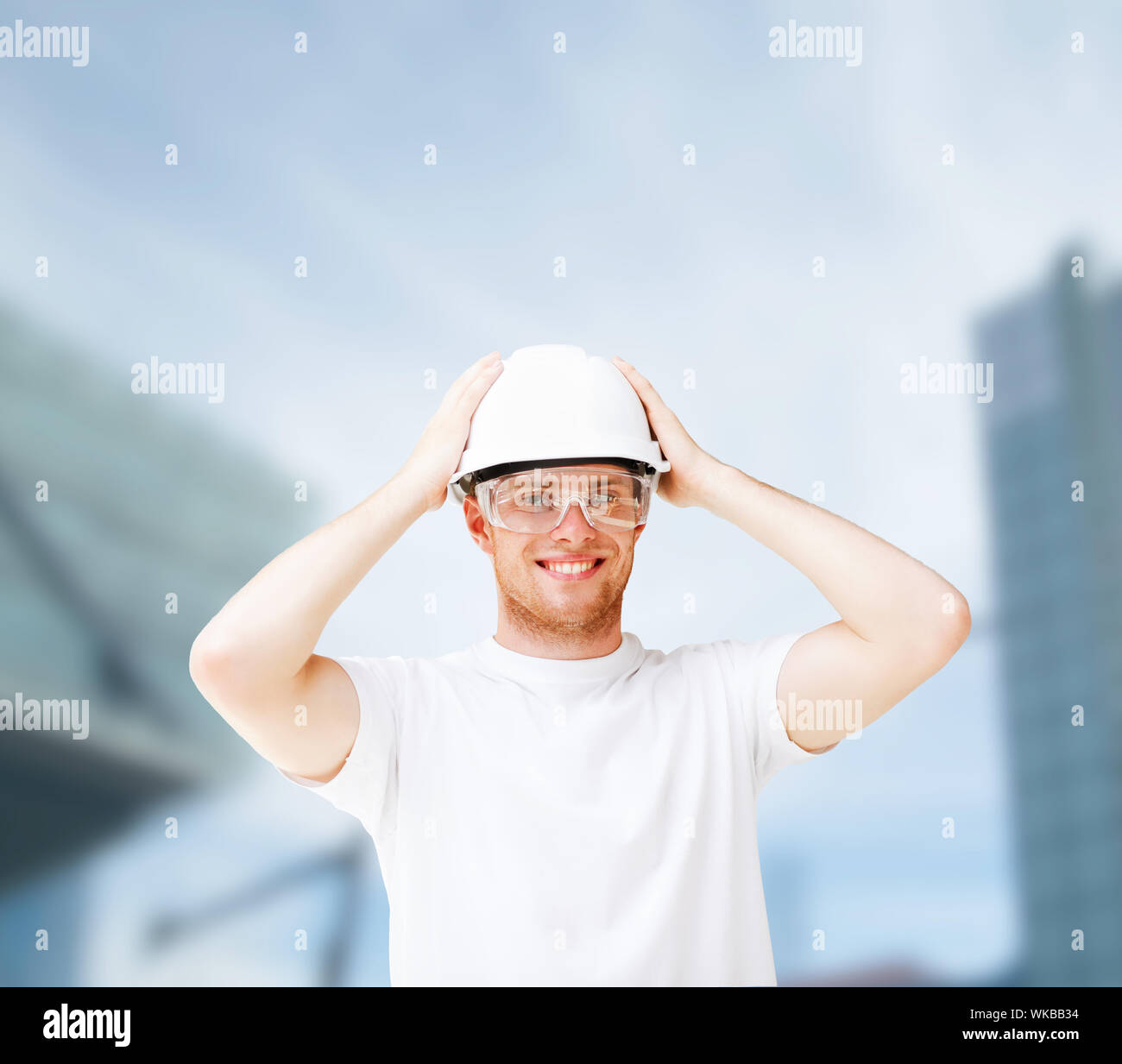male architect in helmet with safety glasses Stock Photo - Alamy