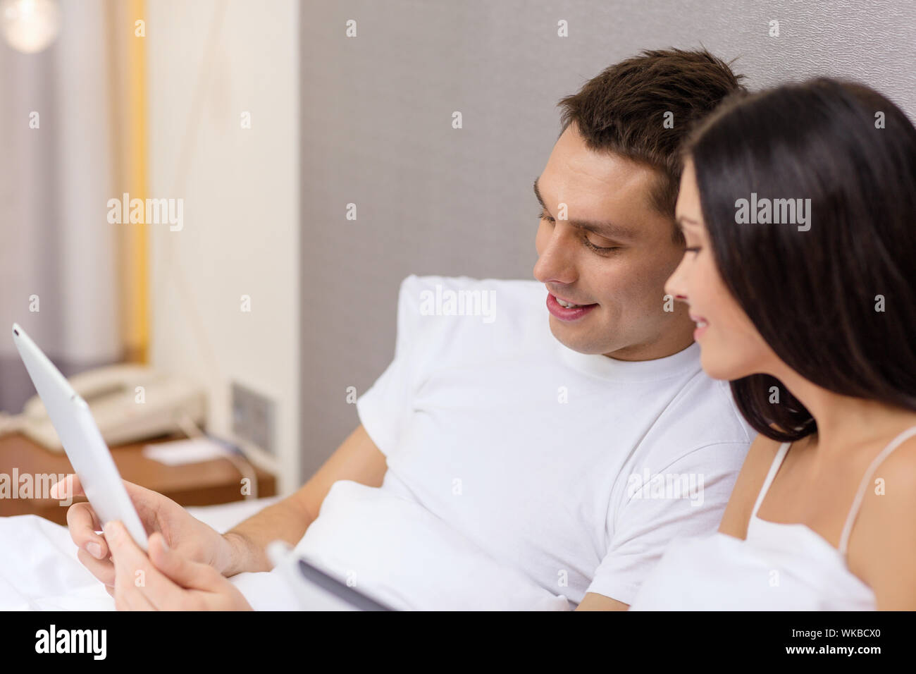 Happy romantic couple computer tablet hi-res stock photography and ...