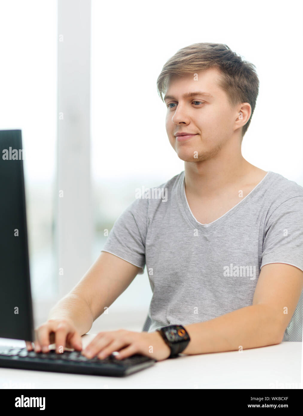 smiling student with computer Stock Photo - Alamy