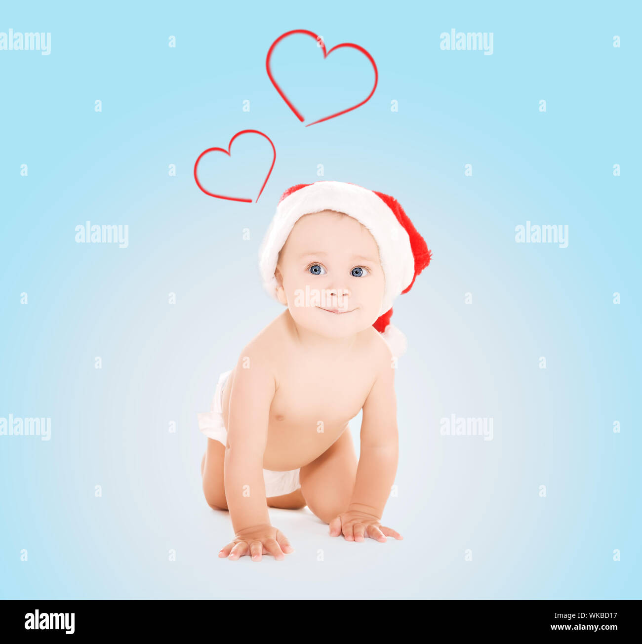 family, children and happiness concept - cute baby in santa helper hat ...