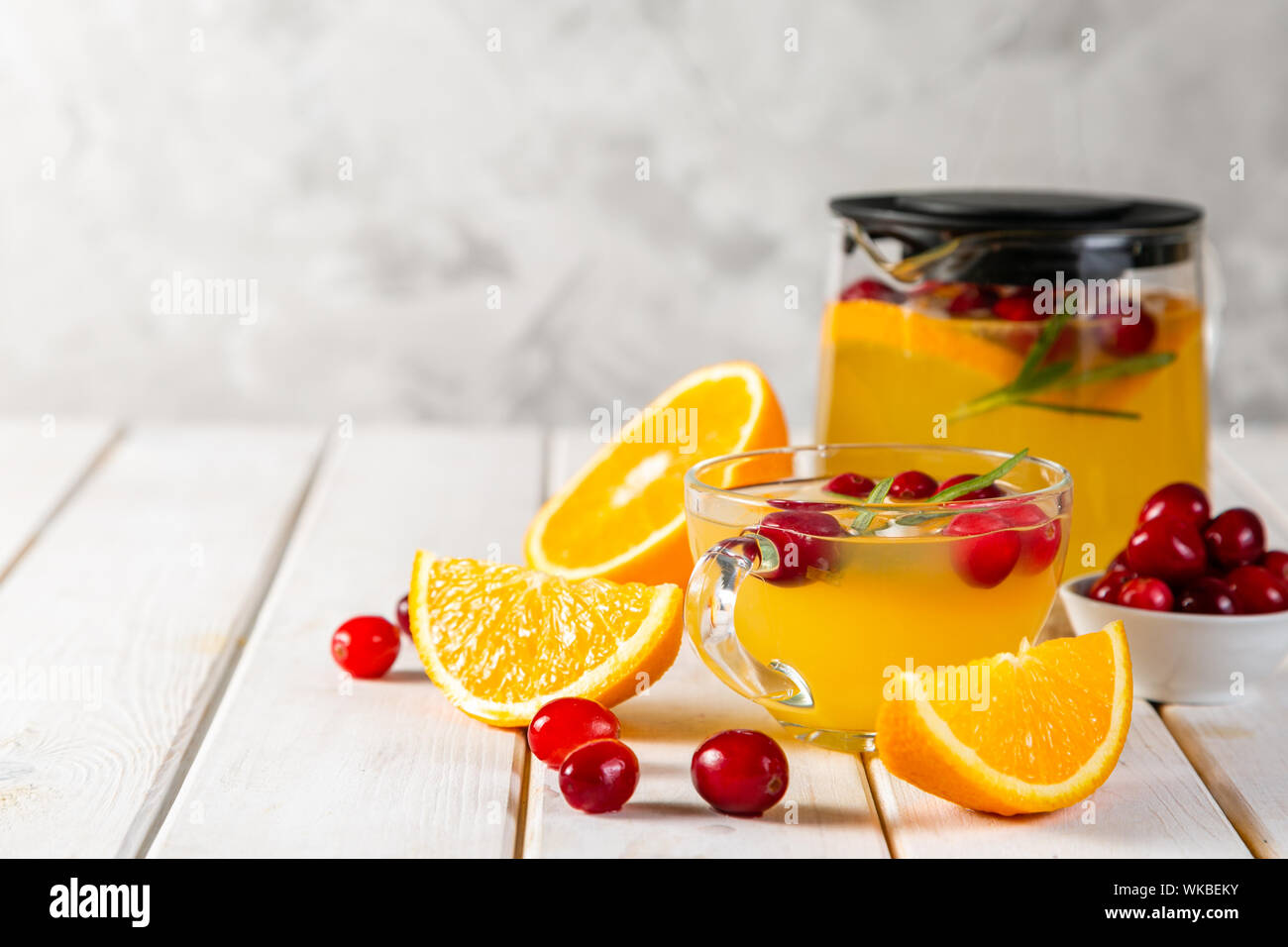 Autumn crunberry, rosemary and orange steaming tea Stock Photo - Alamy