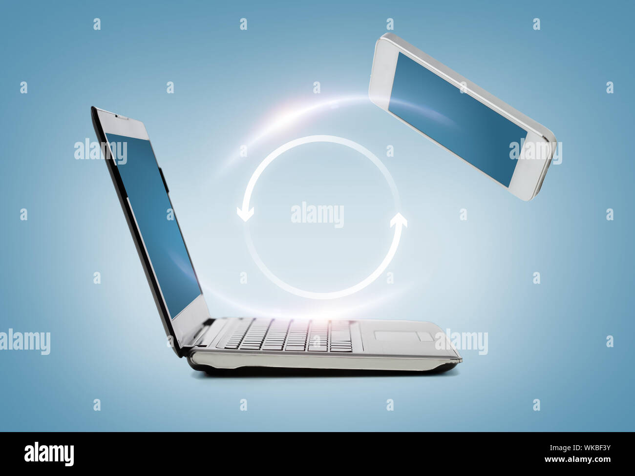 technology and internet concept - smartphone and laptop connecting ...