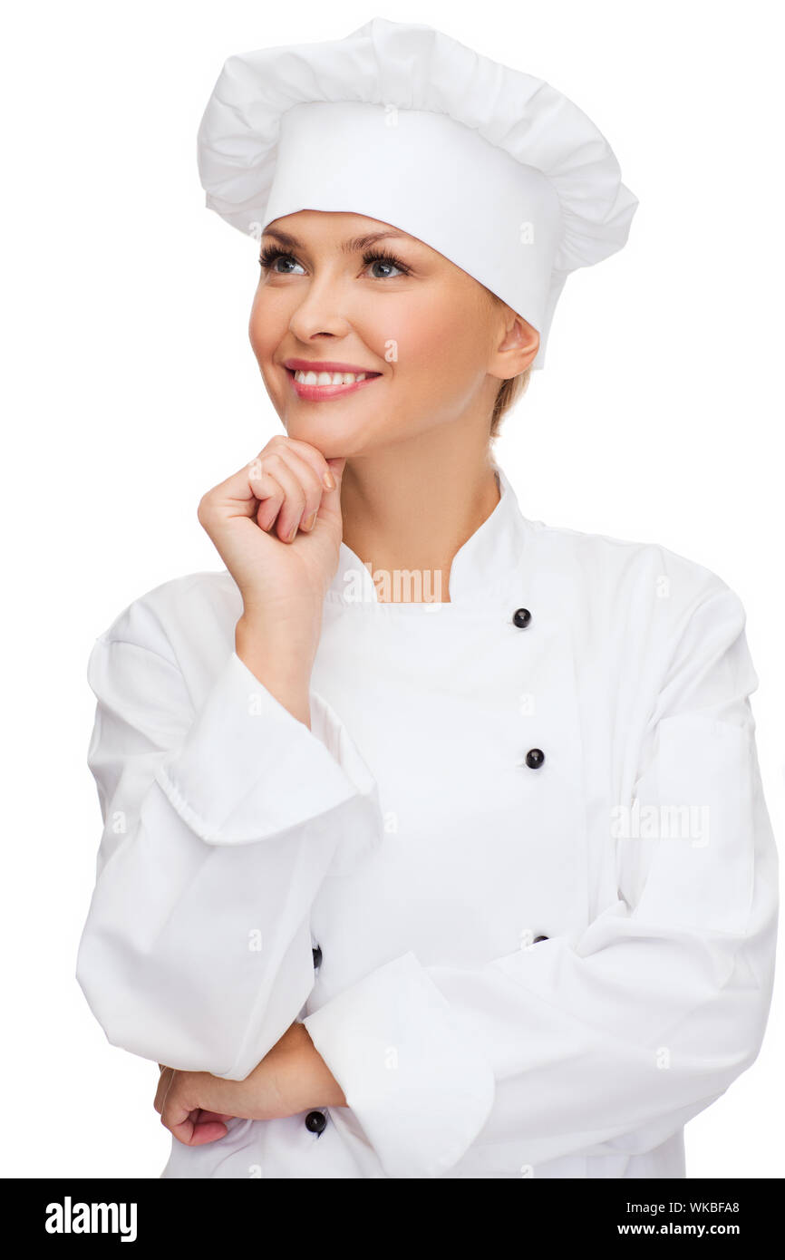 cooking and food concept - smiling female chef, cook or baker dreaming ...