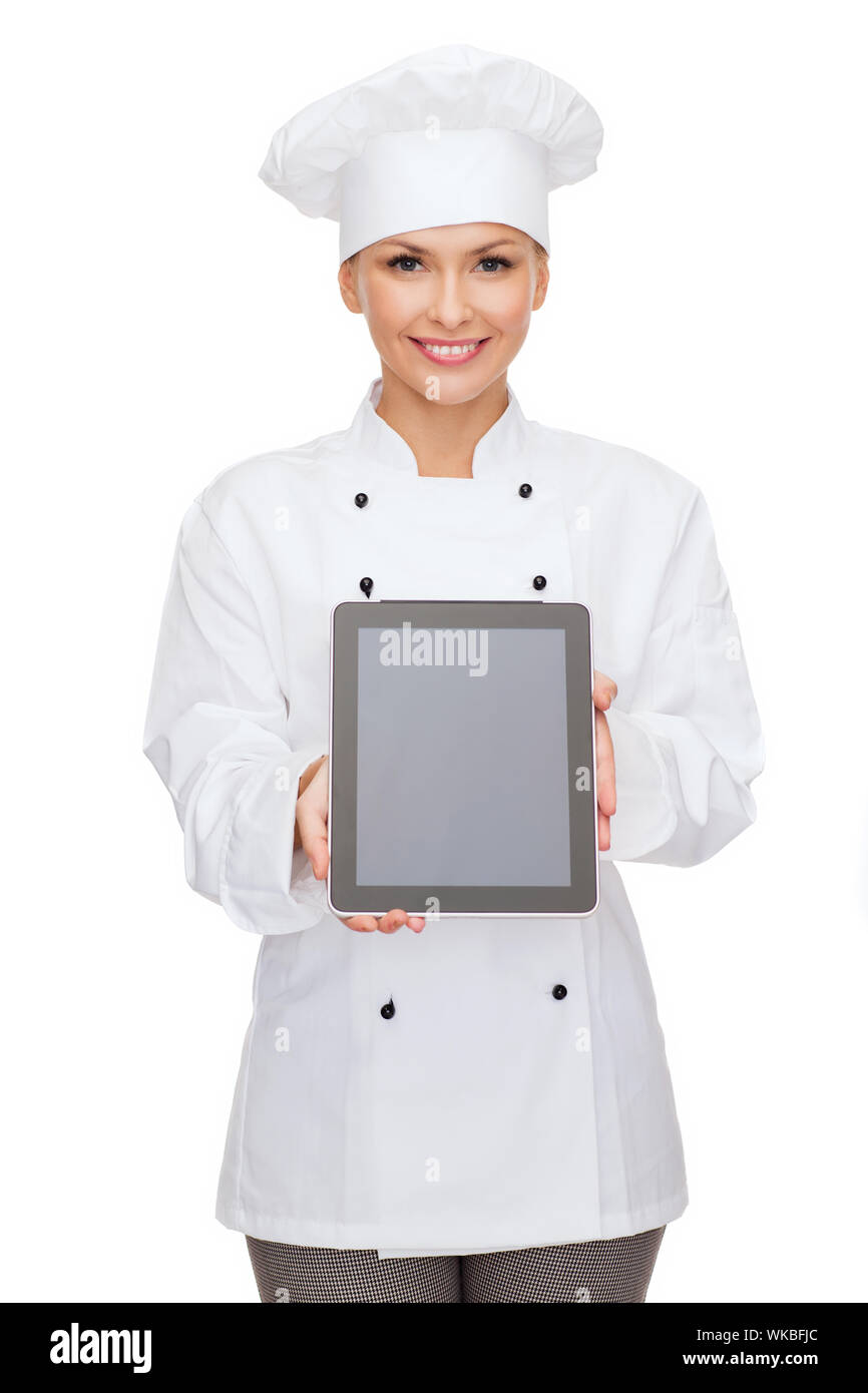 cooking, technology and food concept - smiling female chef, cook or ...