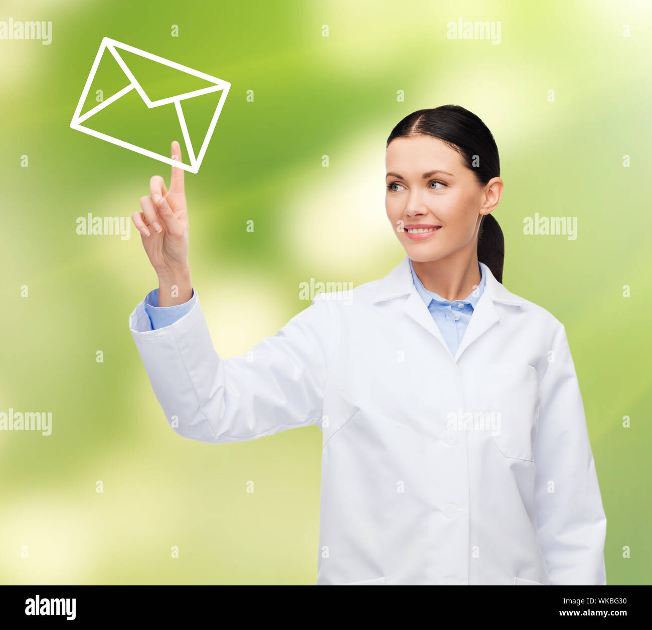 smiling female doctor pointing to envelope Stock Photo - Alamy