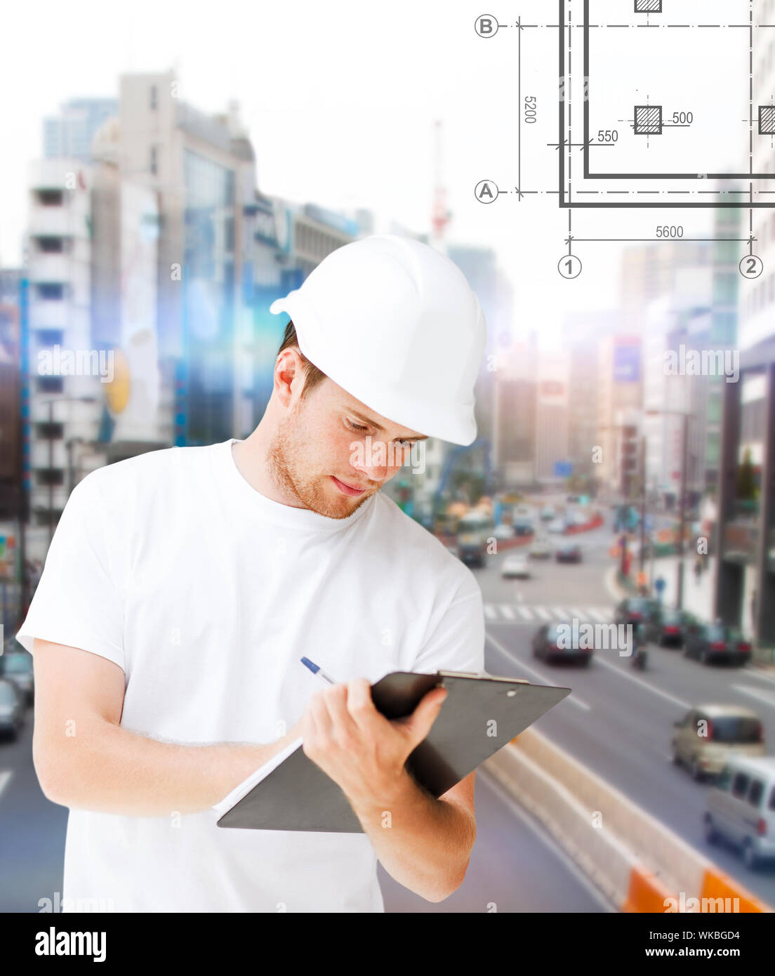 male architect looking at blueprint Stock Photo - Alamy