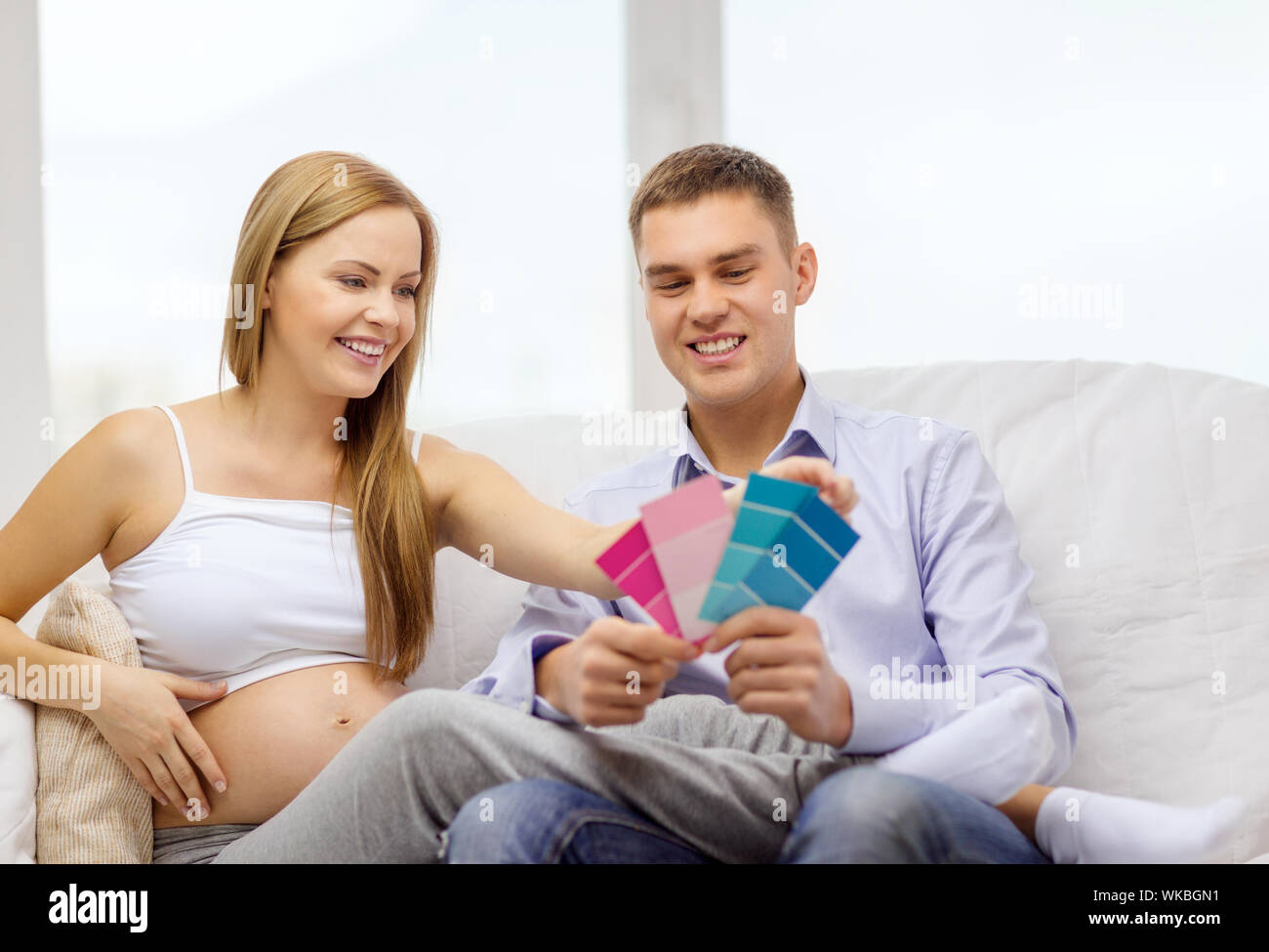 parenthood, renovation and pregnancy concept - smiling expecting ...